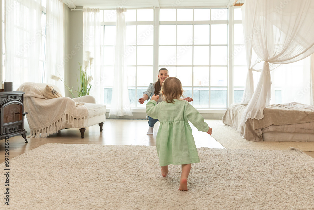 Foto de Baby development. Cute little infant girl making first steps at ...