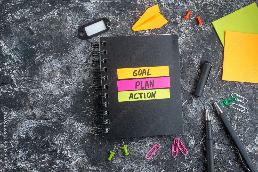 top view goal plan action notes on stickers on gray background college ...