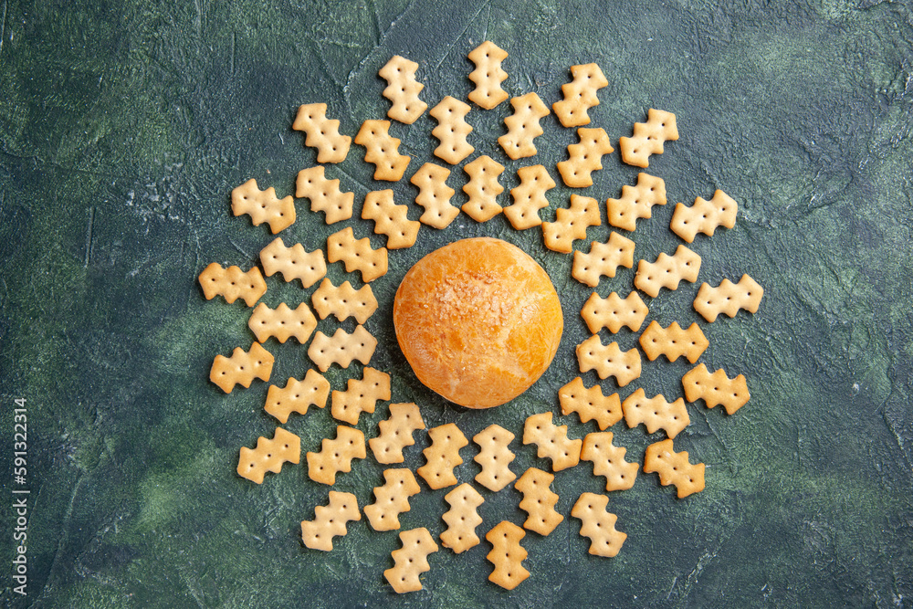 top view little crackers inside plate with pastry on dark background ...