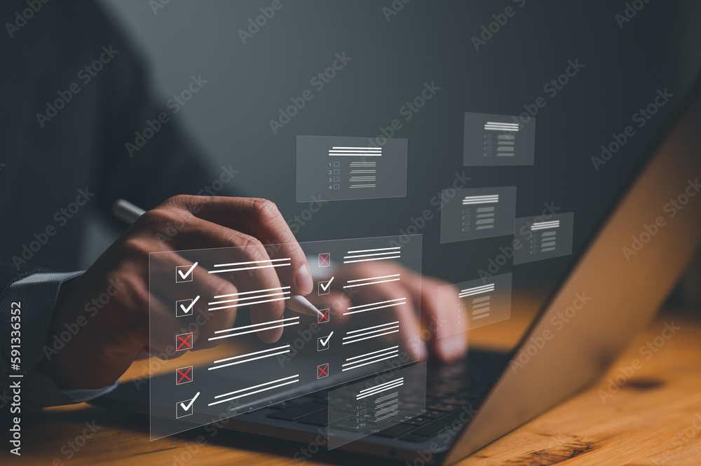 Business performance checklist, businessman using laptop doing online ...