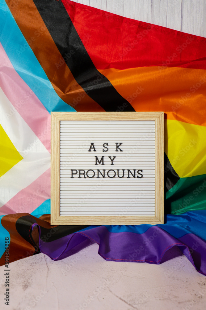 ASK MY PRONOUNS text Neo pronouns concept on Rainbow flag background ...