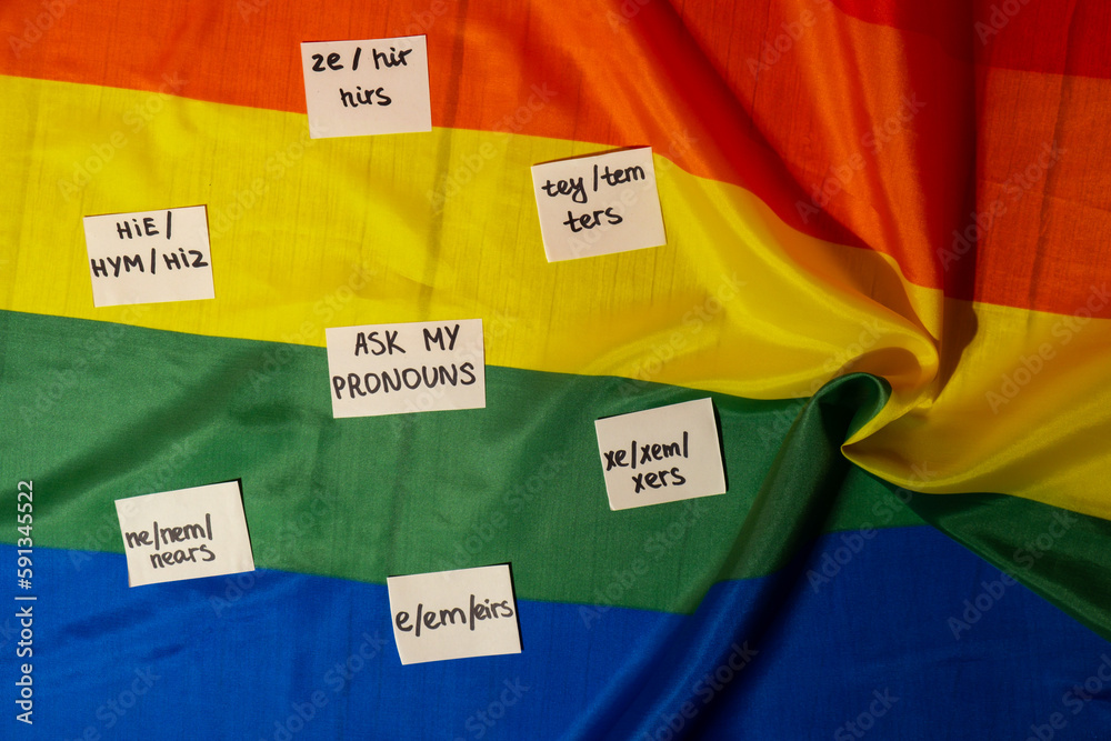 ASK MY PRONOUN Neo pronouns concept. Rainbow flag with paper notes text ...
