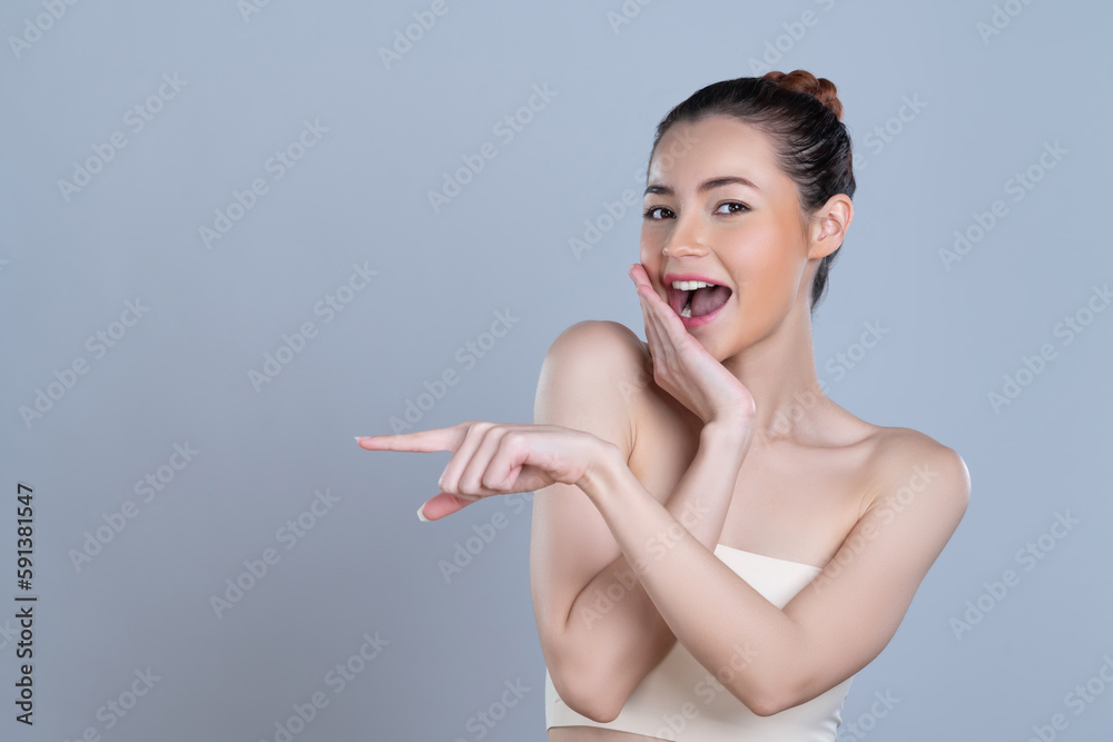 Glamorous beautiful woman with perfect makeup clean skin pointing ...