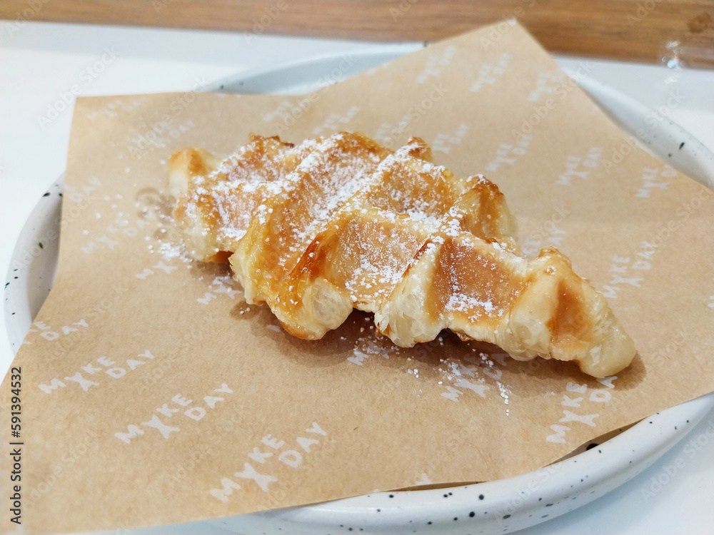 Delicious croffle served on white plate in Thai coffee shop. Croffle ...