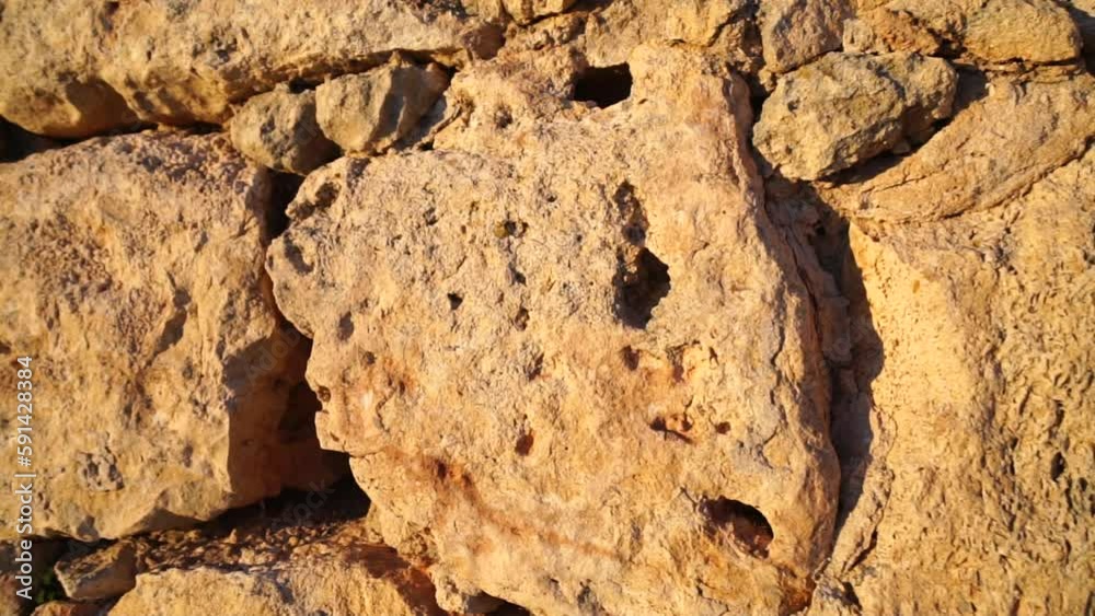 Ancient Stone Wall - Limestone. Fence is made of crude stone limestone ...