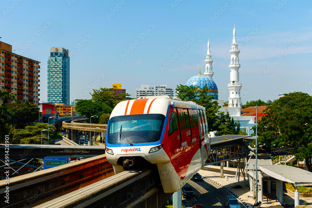KUALA LUMPUR, MALAYSIA - MARCH 14, 2023: Monorail train arrives at the ...
