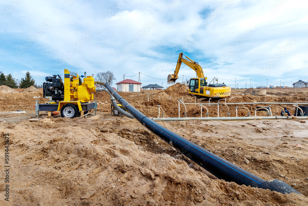 Excavator dig the trenches at a construction site. Trench for laying ...