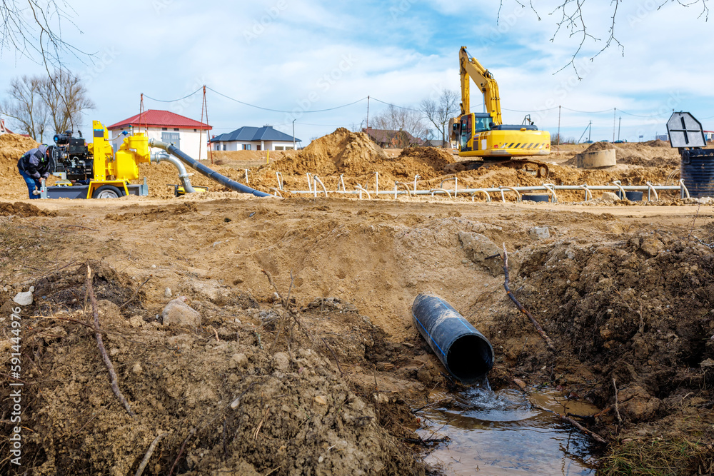 Works on the installation of a dewatering system in the open air with a ...