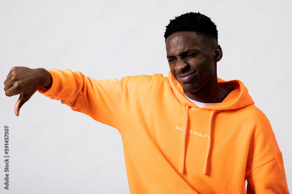 Dissatisfied african american black man guy in stylish hoodie looking ...