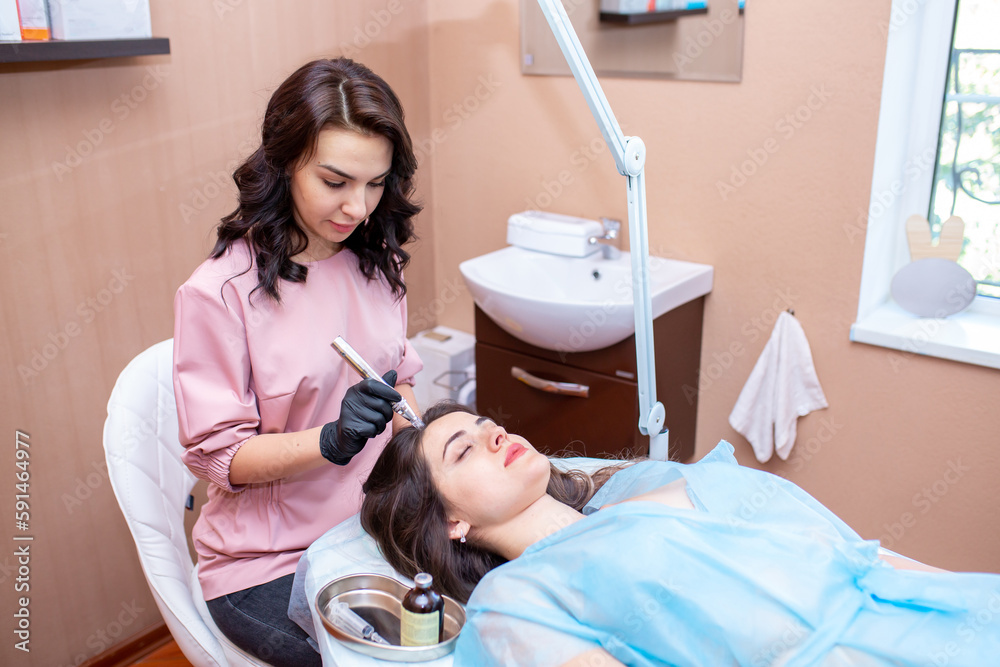 Treatment of the scalp for hair loss, alopecia. A trichologist doctor ...