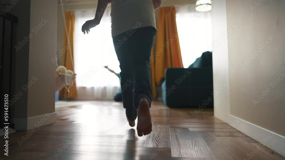 child daughter takes the first steps run on the floor to the father ...