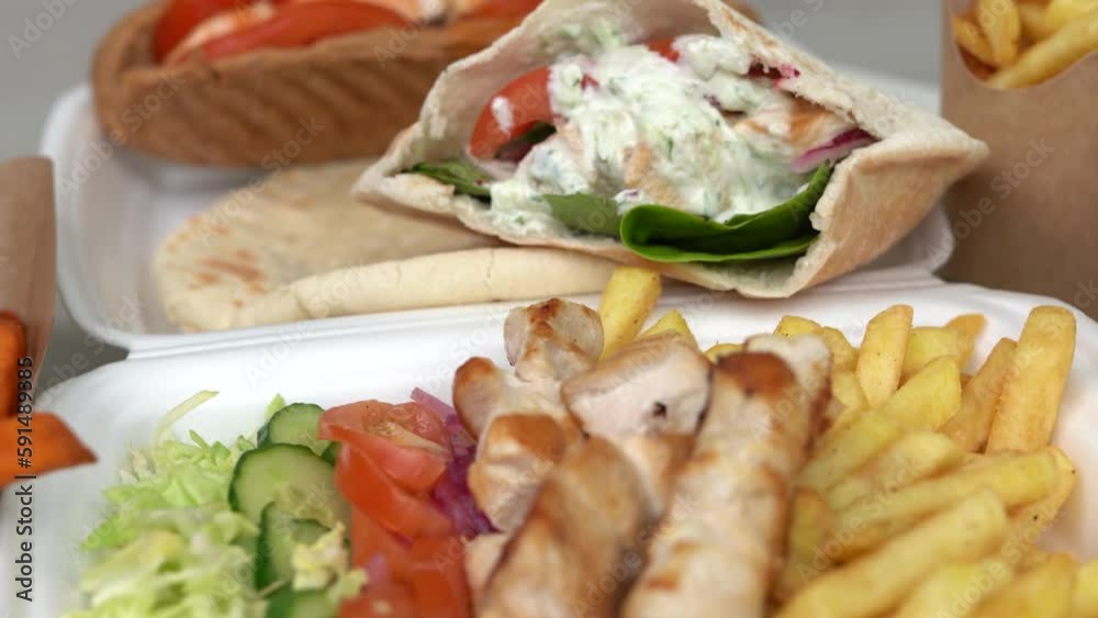 Traditional Greek fast food served on table in a cafe. Gyros sandwich ...