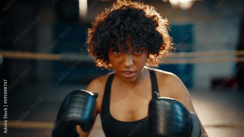 Fighter african american curly girl boxer clapping with boxing gloves ...