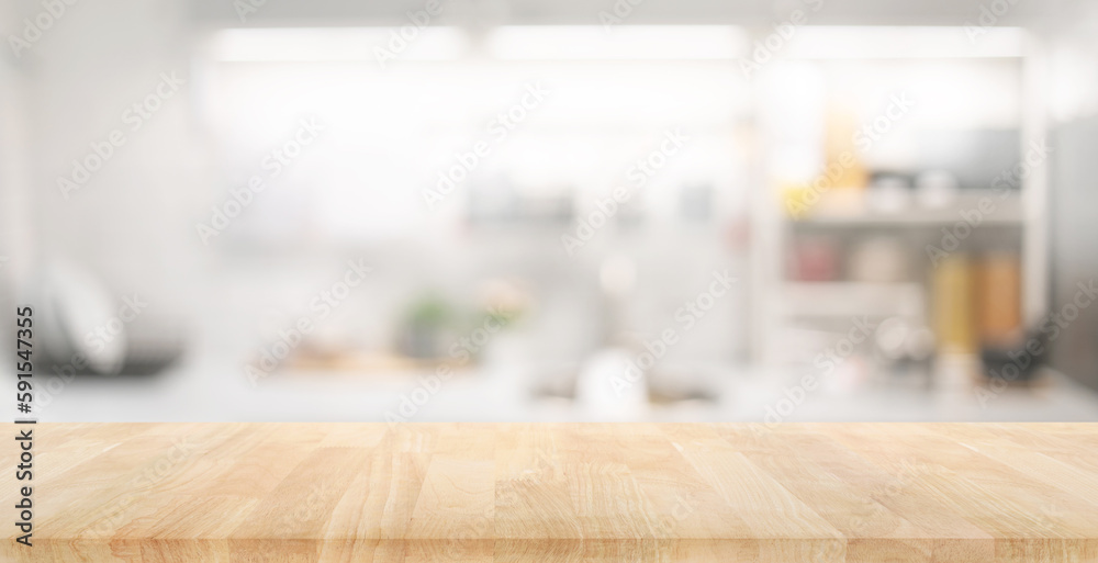 Selective focus.Wood table top on blur kitchen counter background.For ...