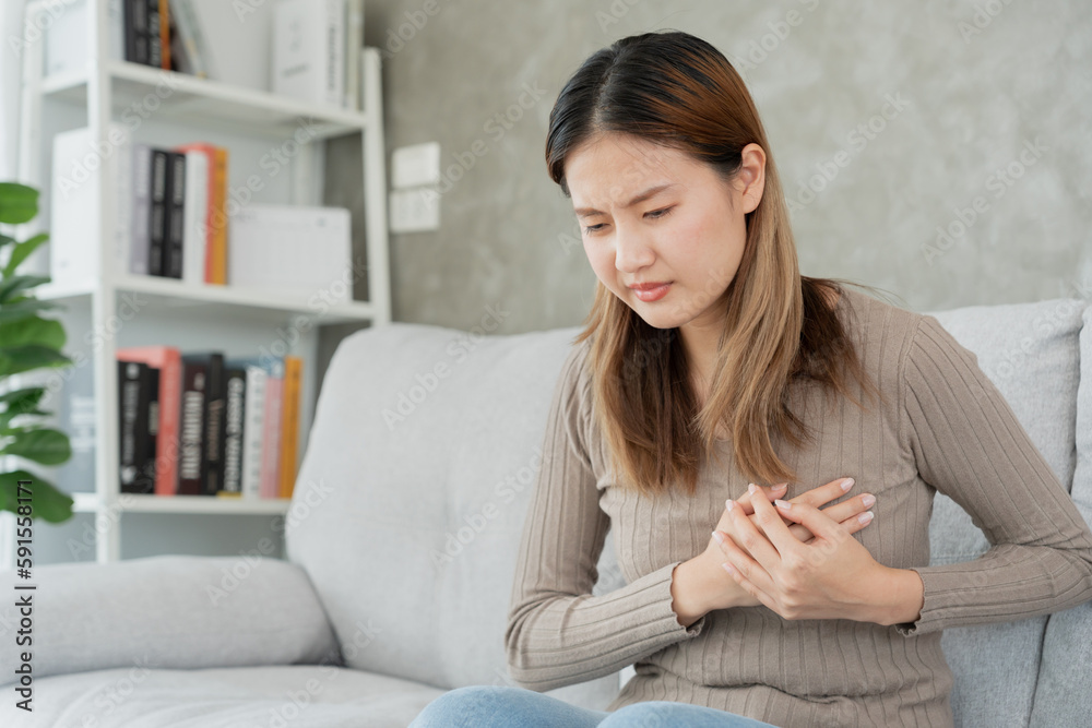 heart attack, hand holding chest with heart attack symptoms, asian ...