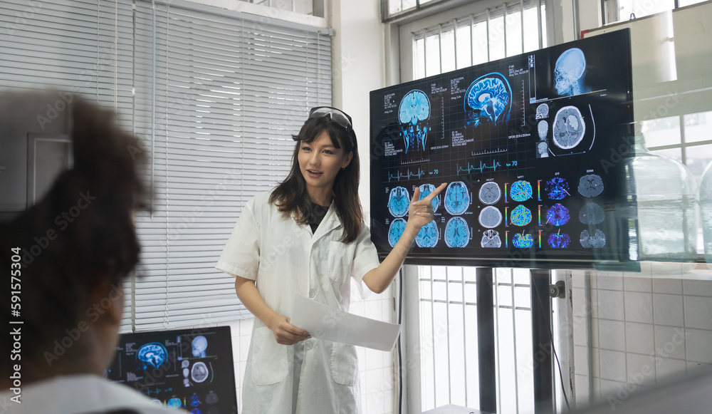 Female medical scientists presenting in brain research laboratory by ...