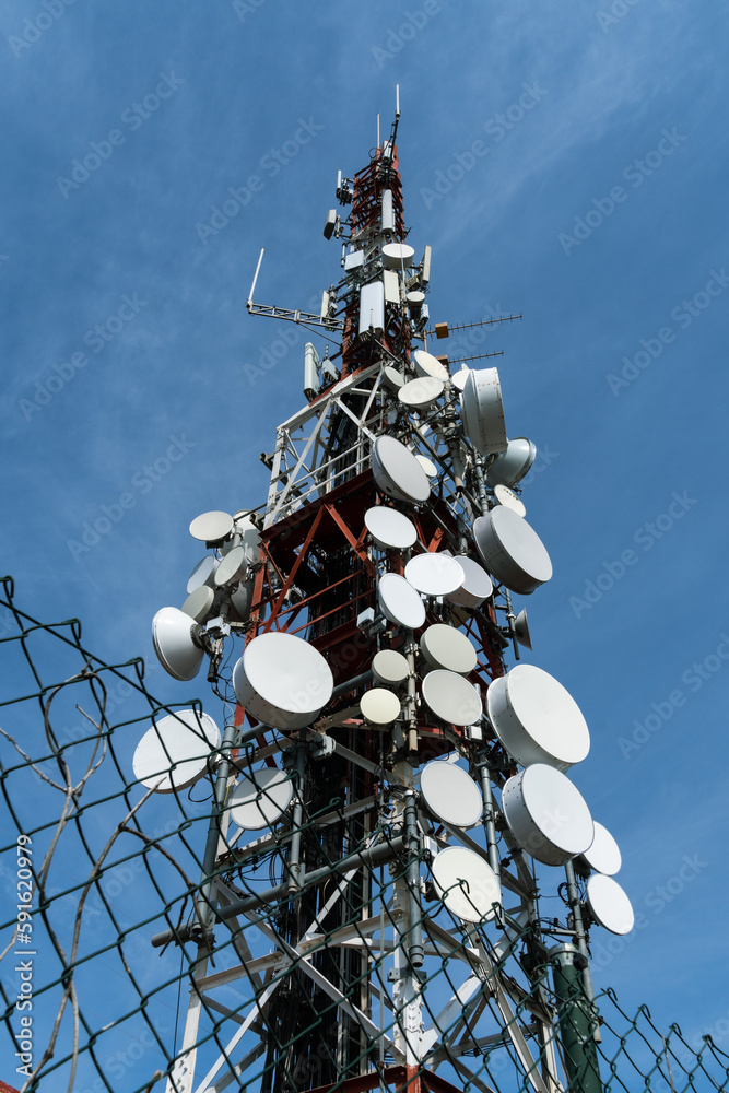 High-quality photo of a 5G antenna tower against a dramatic sky ...