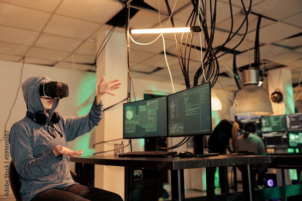 Foto de Cybercriminal working with professional vr glasses to crack encryption, trying to steal ...