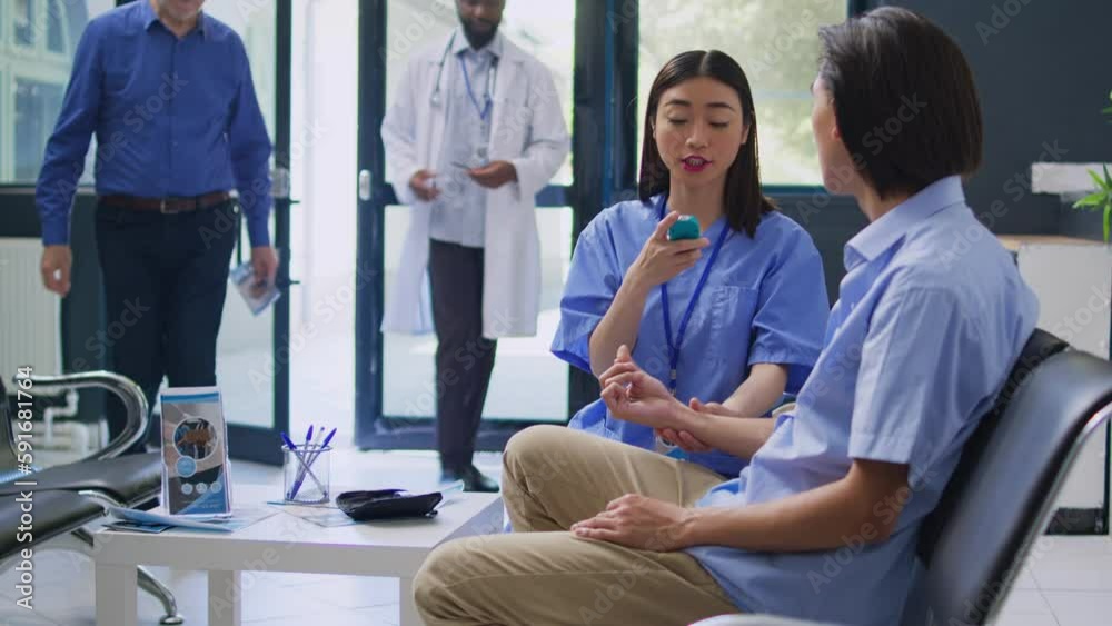 Vídeo do Stock: Nurse checking blood sample for diabetic asian man ...