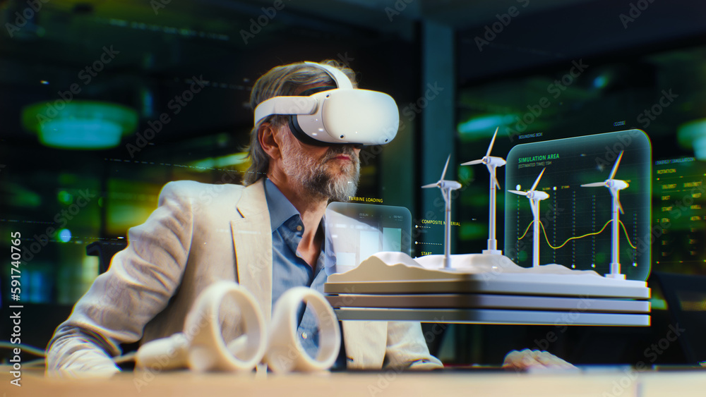 Male engineer uses VR headset, watches and checks engineering project ...