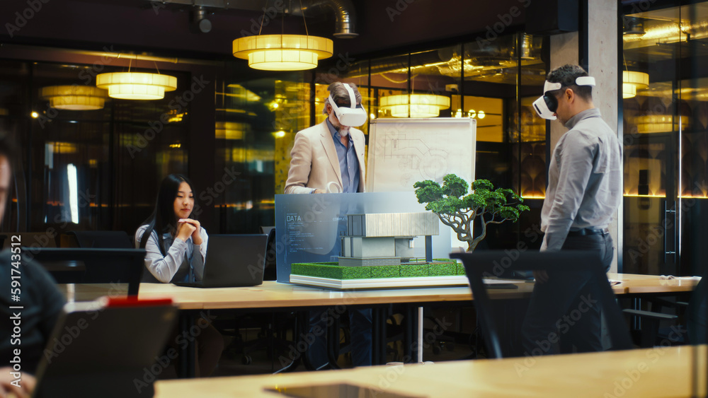 Diverse designers use VR headsets, make architectural project, create ...