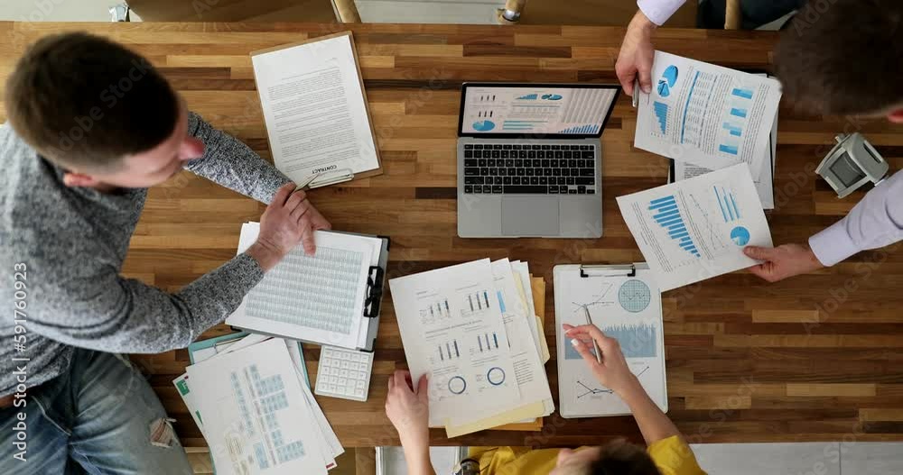 Hardworking colleagues examine investigation papers with statistics ...