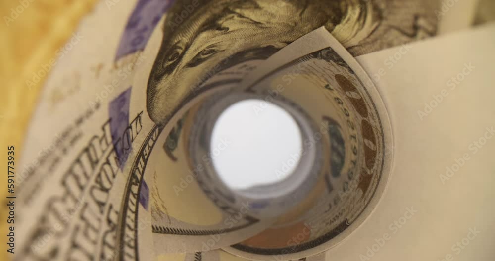 Twisted in pipe dollars with various denominations. Long money funnel ...