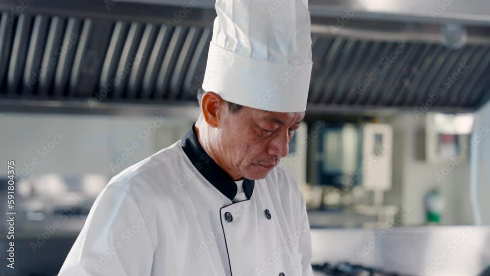 4K, Close-up this man's face who is chef at restaurant in kitchen here ...