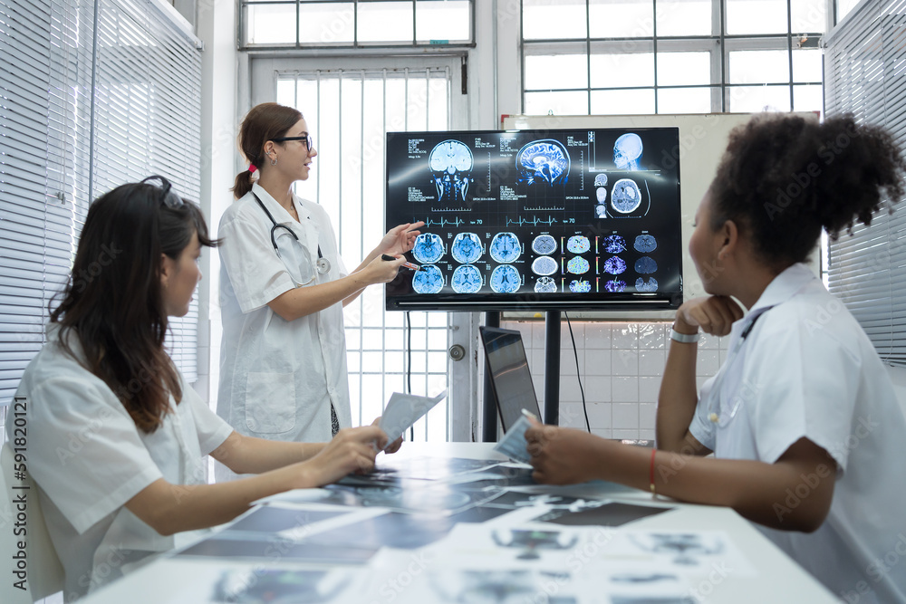 Group of female medical scientists meeting in brain research lab by ...