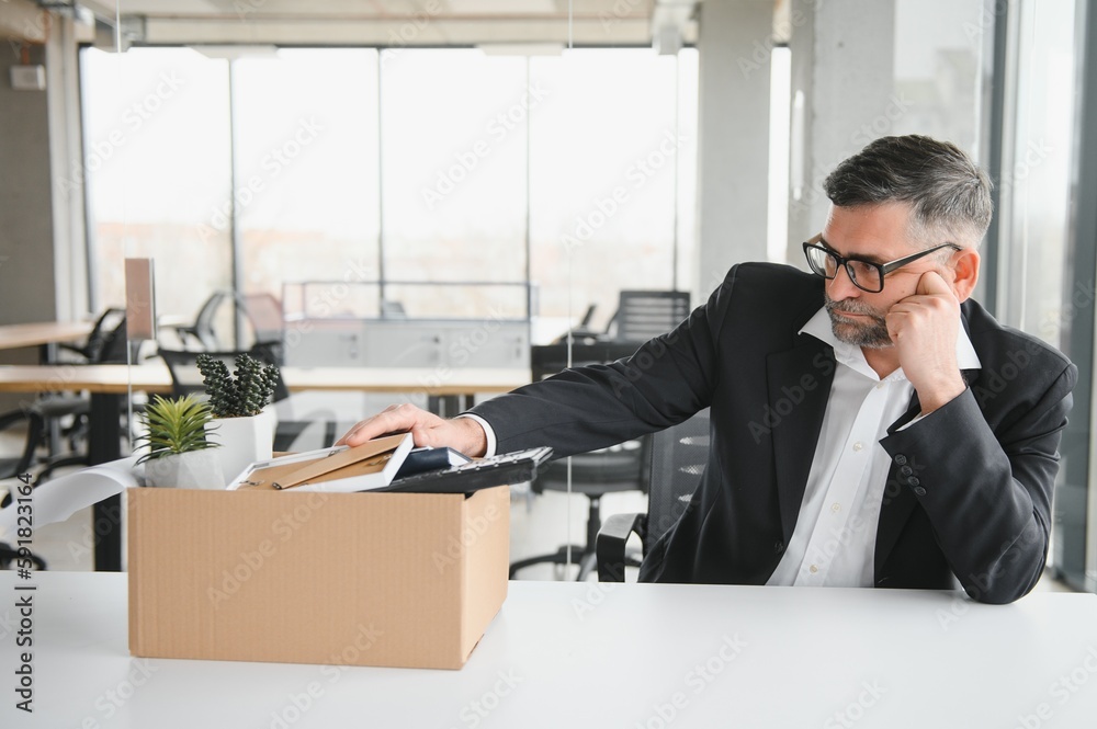 old employee leaving office with the box full of belongings Stock Photo ...