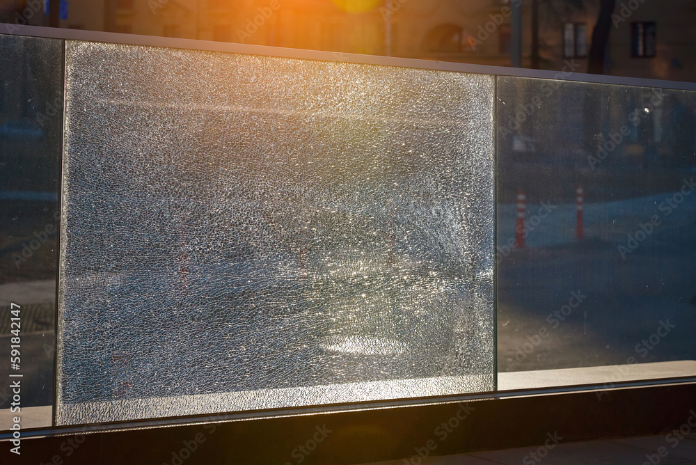 Damaged tempered glass fence. Broken glass fence with banisters. Broken ...