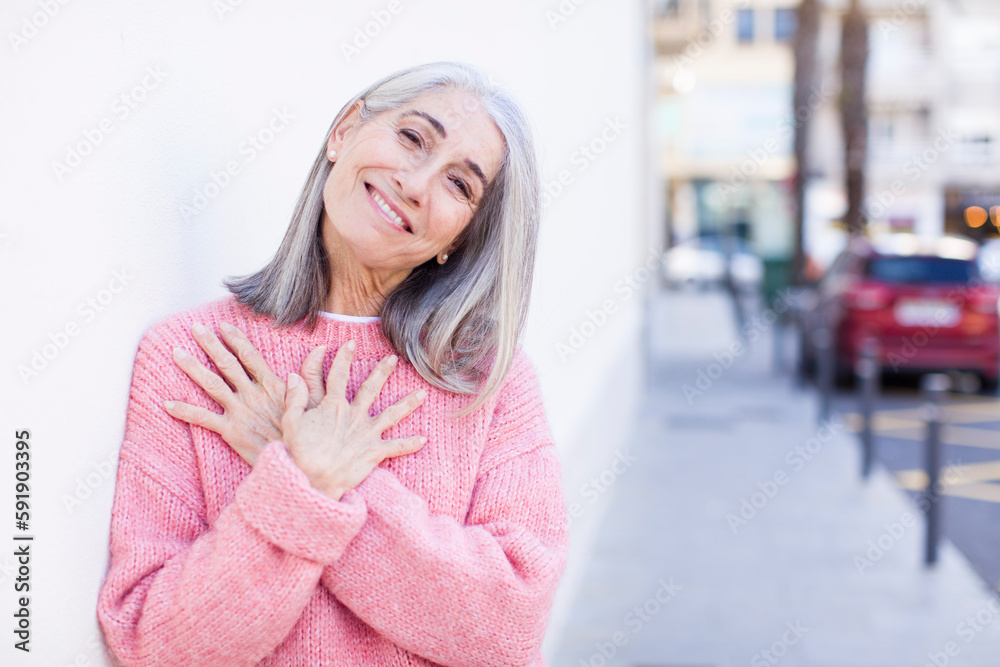 senior retired pretty white hair woman feeling romantic, happy and in ...