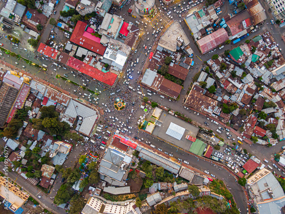 Foto de Aerial view of the city centre of Gondar with a lot of car and ...