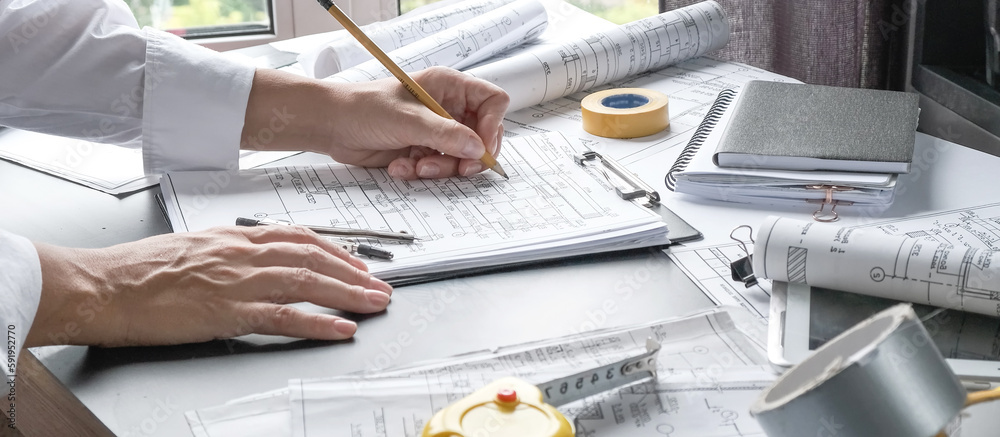 Architect works remotely from home in quarantine, lockdown covid 19 coronavirus. Remote work ...