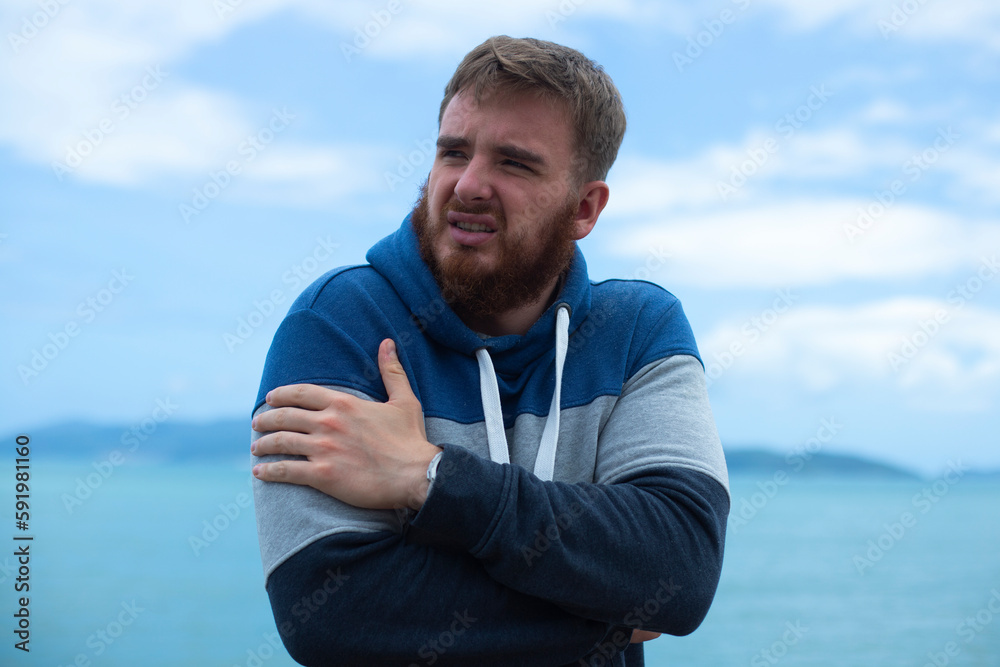 Portrait of unhappy depressed frozen trembling guy, young shivering ...
