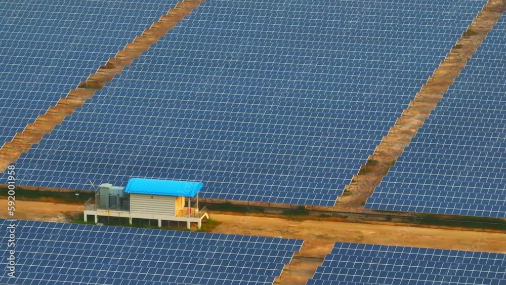 Vidéo Stock From an aerial view drone, a solar power plant appears as a ...
