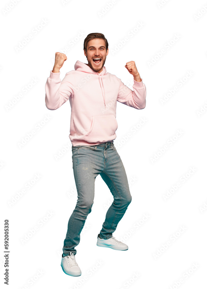 Full length of a cheerful young man standing and celebrating success ...