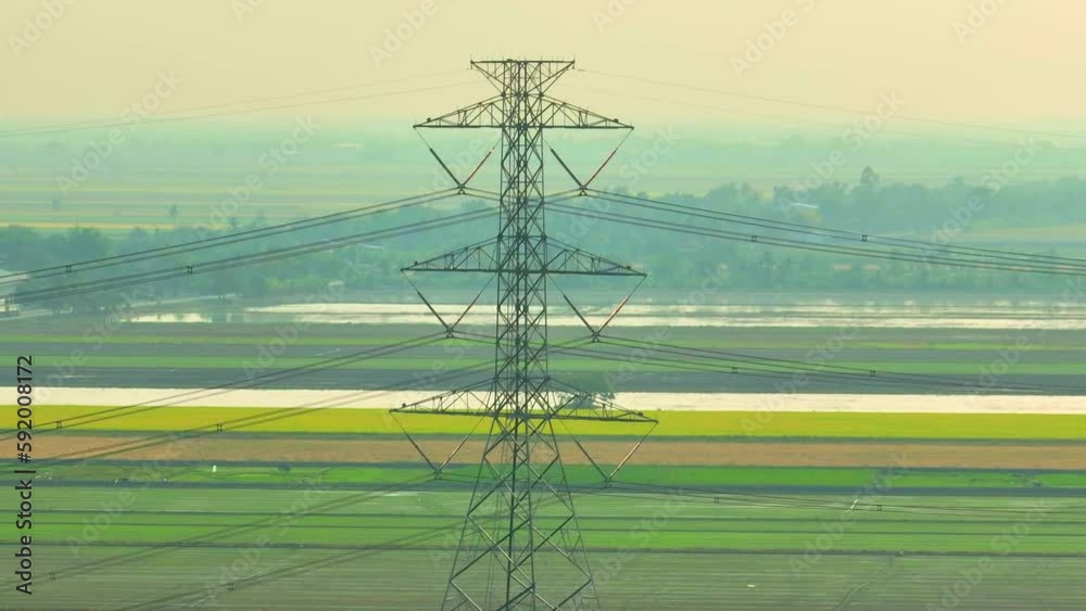 A high voltage pole can appear as a tall and slender structure ...