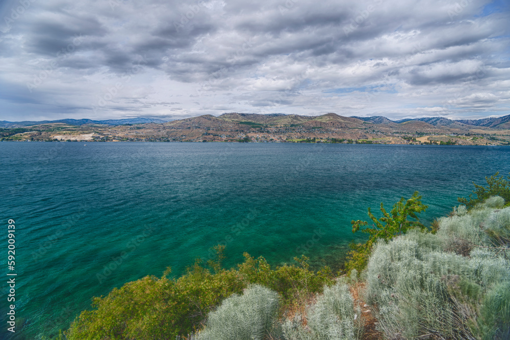 Beautiful clear waters of Lake Chelan on the east side of the Cascade ...