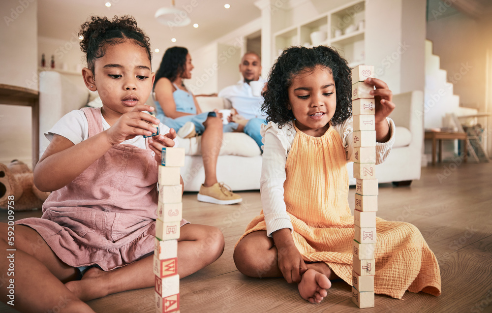 Toys, building blocks and children on a living room floor for bonding ...