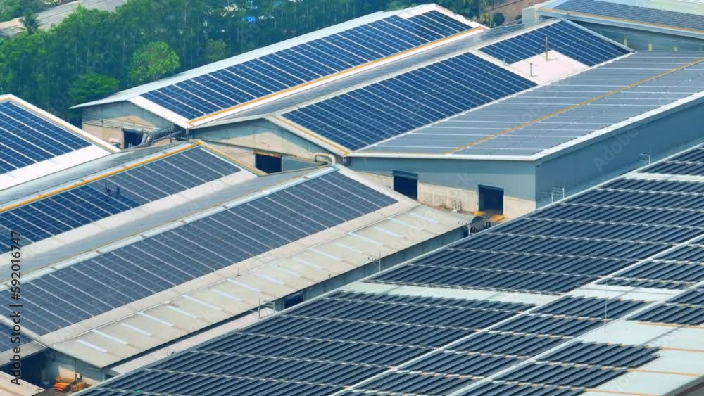Solar panels on the industrial factory roof in the context of clean ...