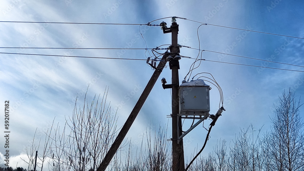 Power electric pole with line wire on blue background close up ...