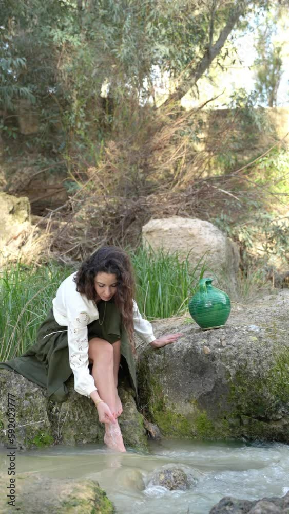 Barefoot woman taking a soothing bath that heals emotions in a body and ...