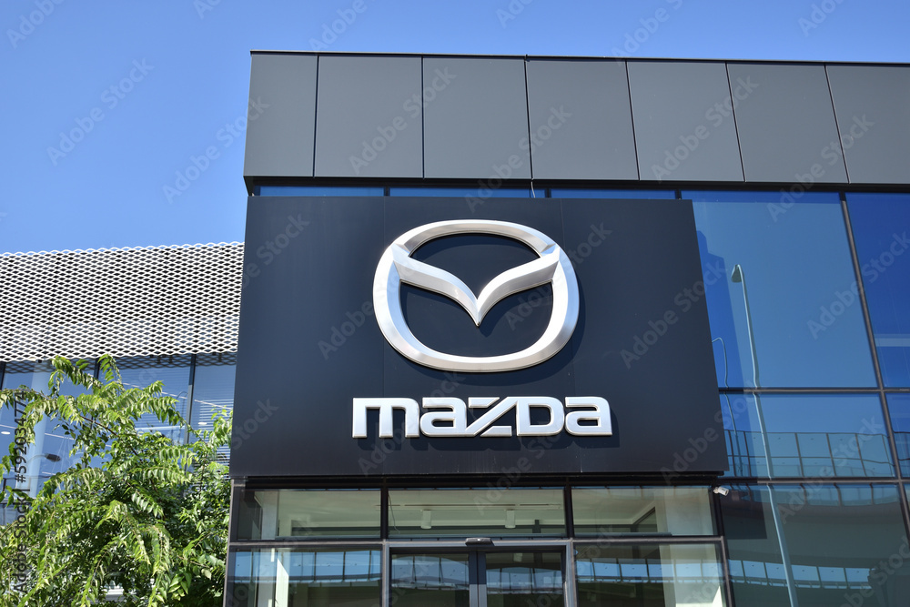 Mazda emblem, sign, logo at the Warszawa Mazda Nivette car dealer salon ...