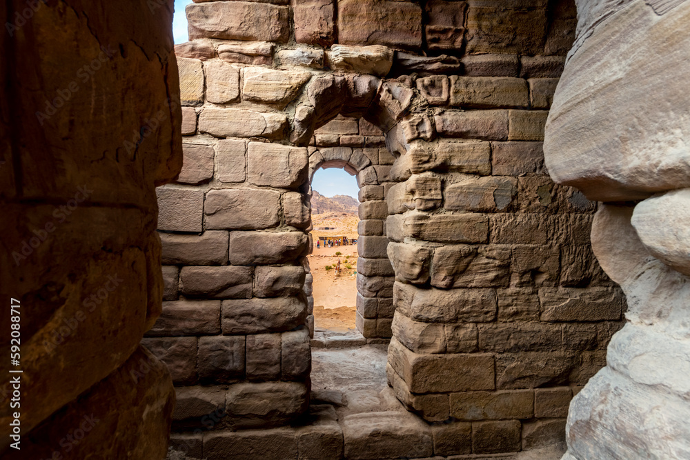 View through an arched stone brick window from the hillside site of the ...