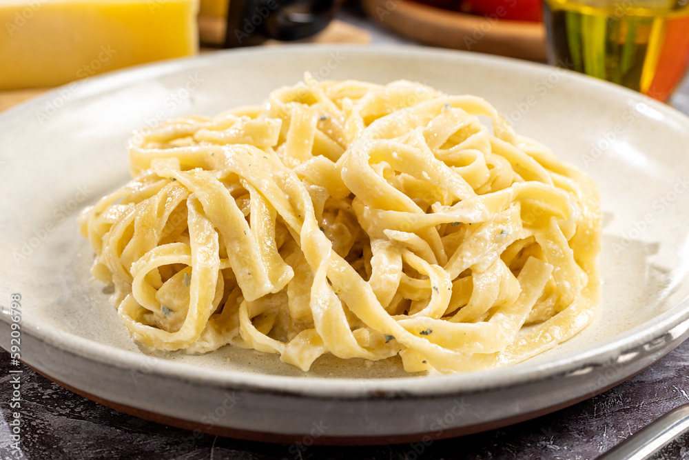 Delicious fettuccine pasta with white cheese sauce. Fettuccine pasta ...
