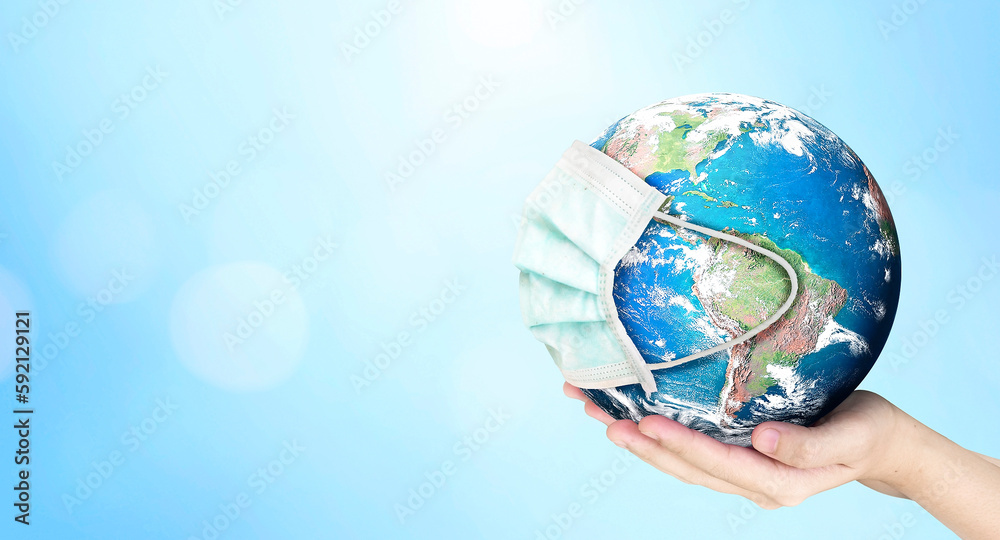 Earth Day concept, Earth wearing a mask on blurred blue nature ...