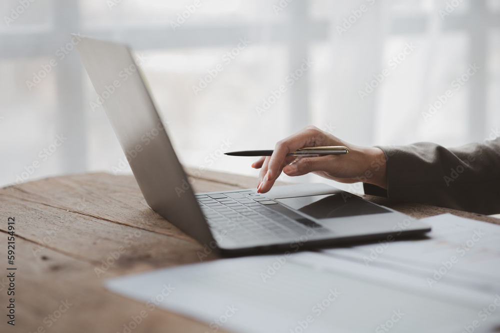 Person typing on laptop keyboard, businessman working on laptop, he is ...