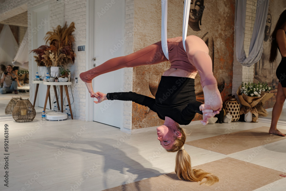 workshop of air yoga and stretching in yoga studio. women practices ...