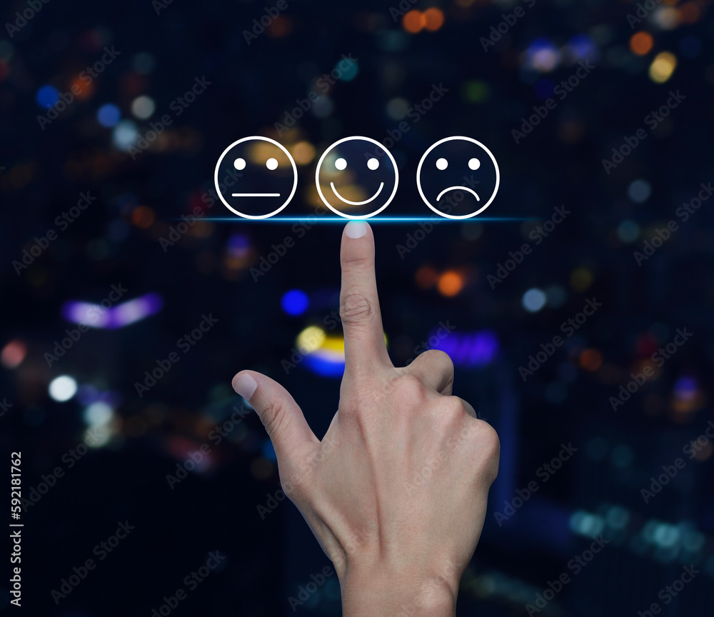 Hand pressing excellent smiley face rating icon over blur colorful ...